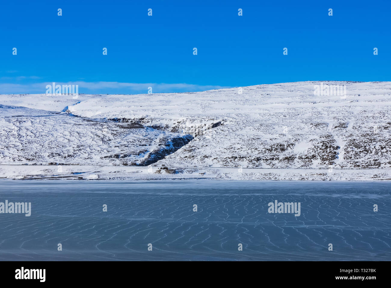 Ice patterns in a dramatic winter landscape along Ísafjarðardjúp fjord ...