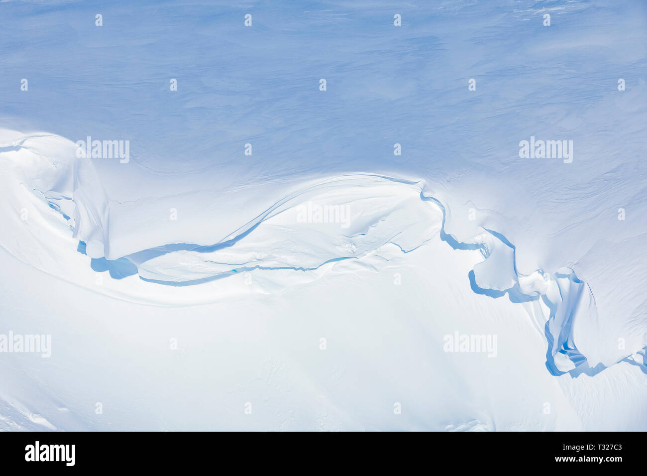 Snow cornice in a dramatic winter landscape along Ísafjarðardjúp fjord ...