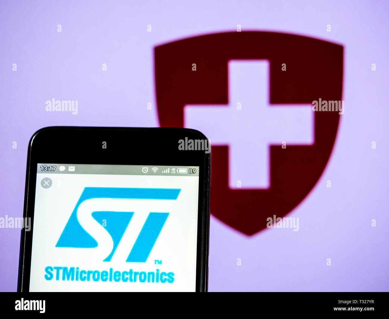 In this photo illustration a STMicroelectronics logo seen displayed on ...