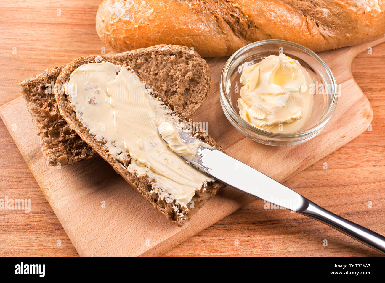 Knife spread butter on bread hi-res stock photography and images - Alamy