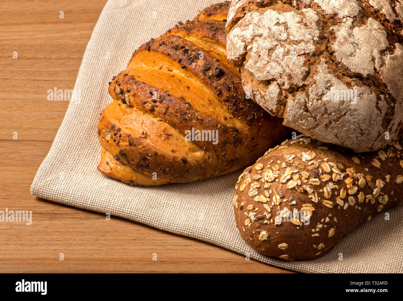 Variety of bread on canvas napkin Stock Photo - Alamy
