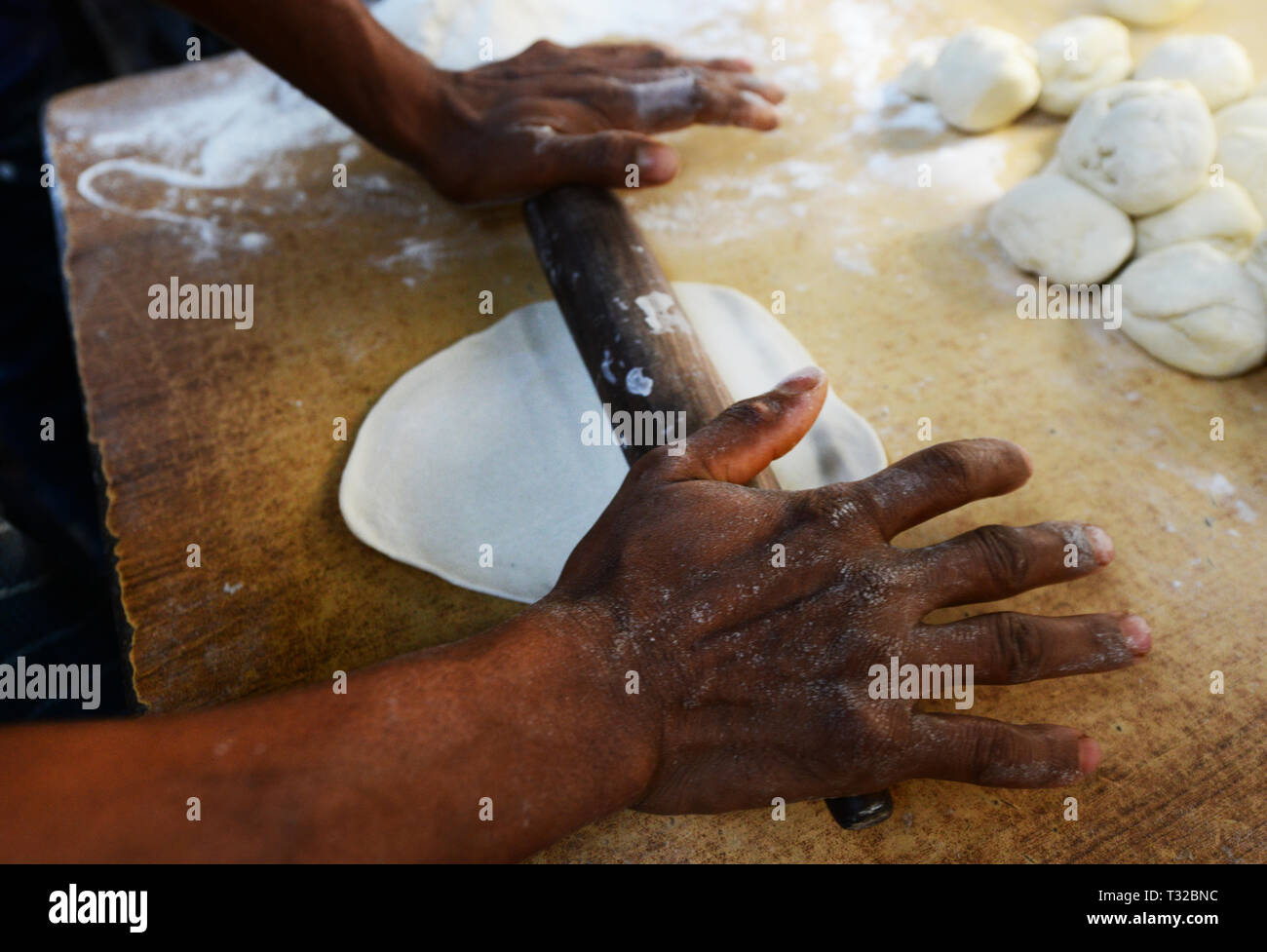 Preparing Roti bread in a small restaurant in Dhaka Stock Photo - Alamy