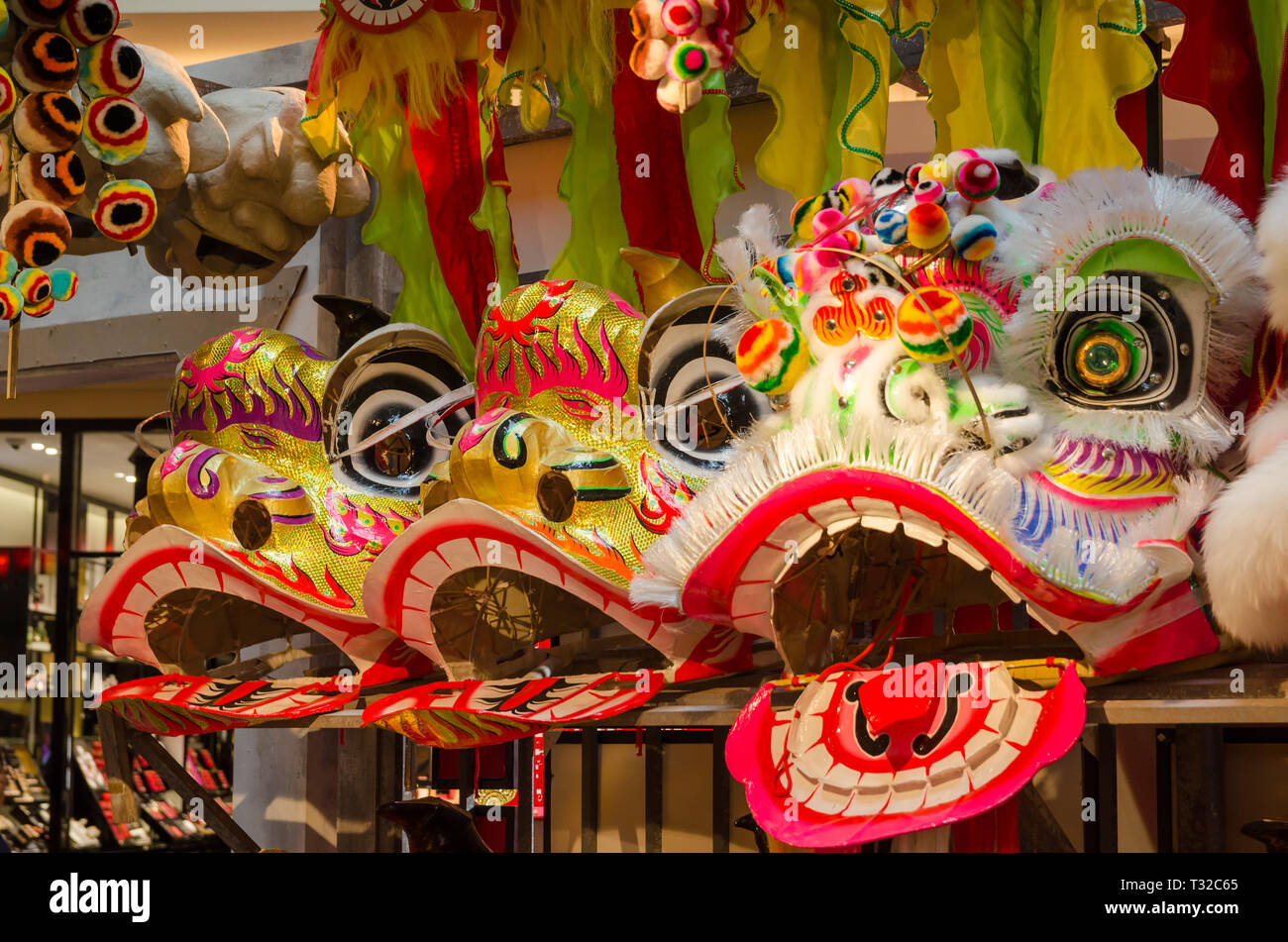 Traditional chinese lion dance head display on the shelves Stock Photo ...