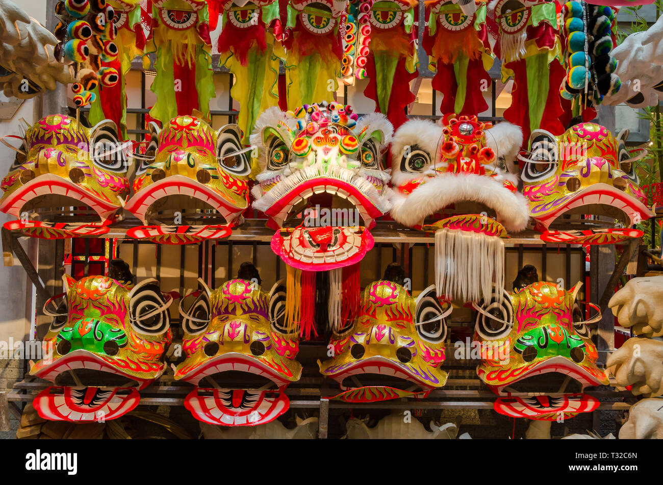 Traditional chinese lion dance head display on the shelves Stock Photo ...