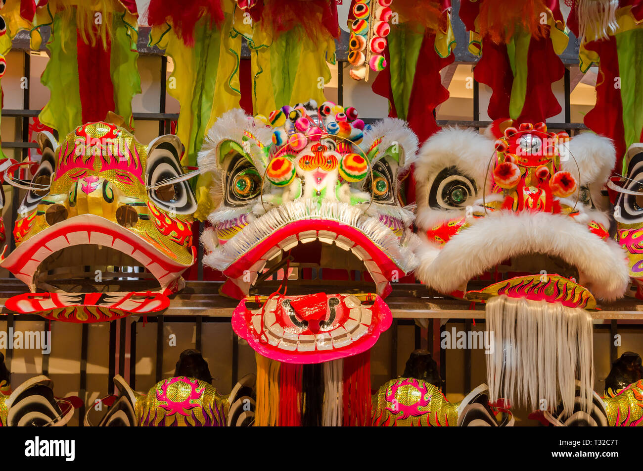 Traditional chinese lion dance head display on the shelves Stock Photo ...