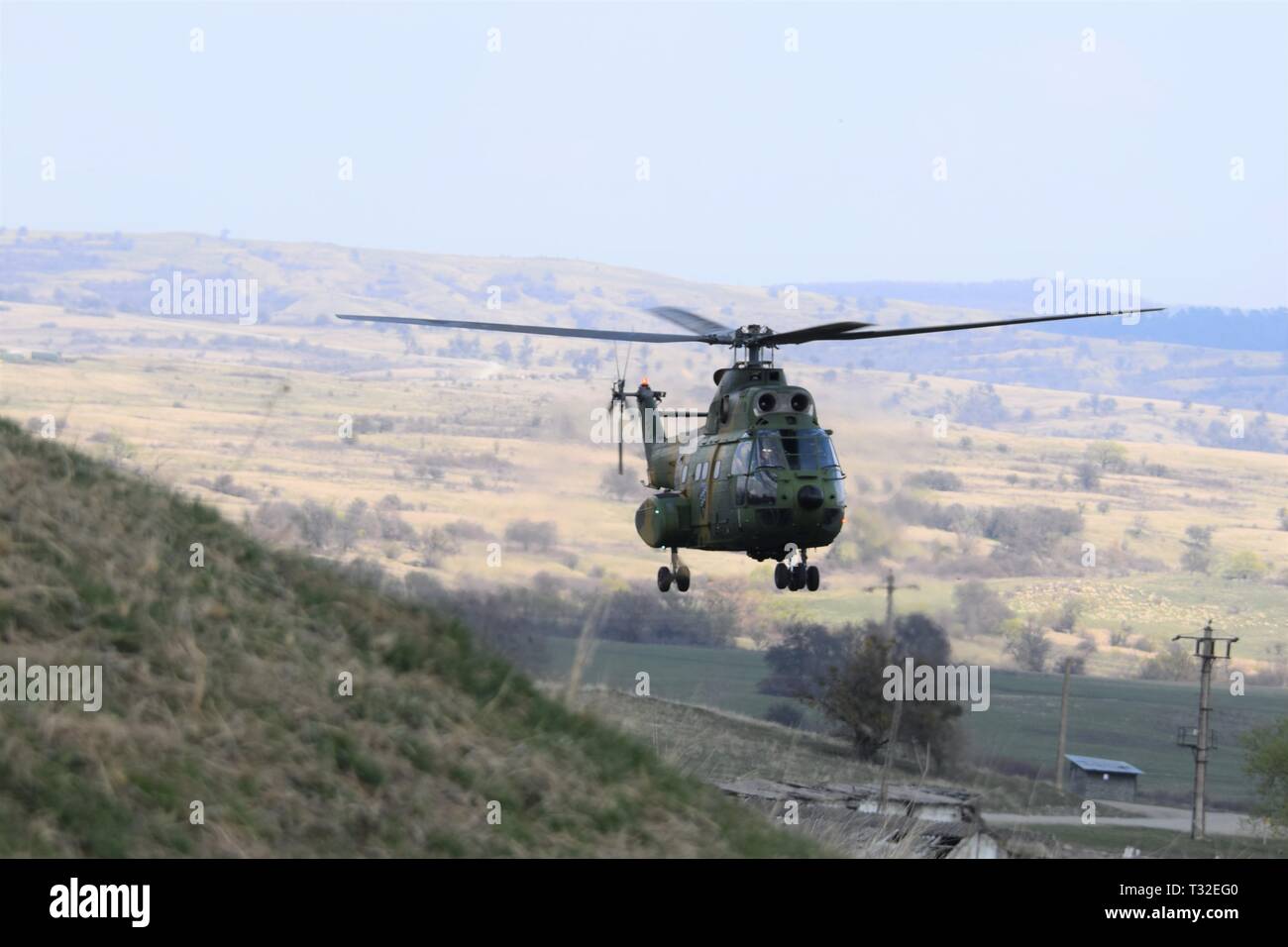 A Romanian IAR 330 “Puma” helicopter performs a practice landing at the ...
