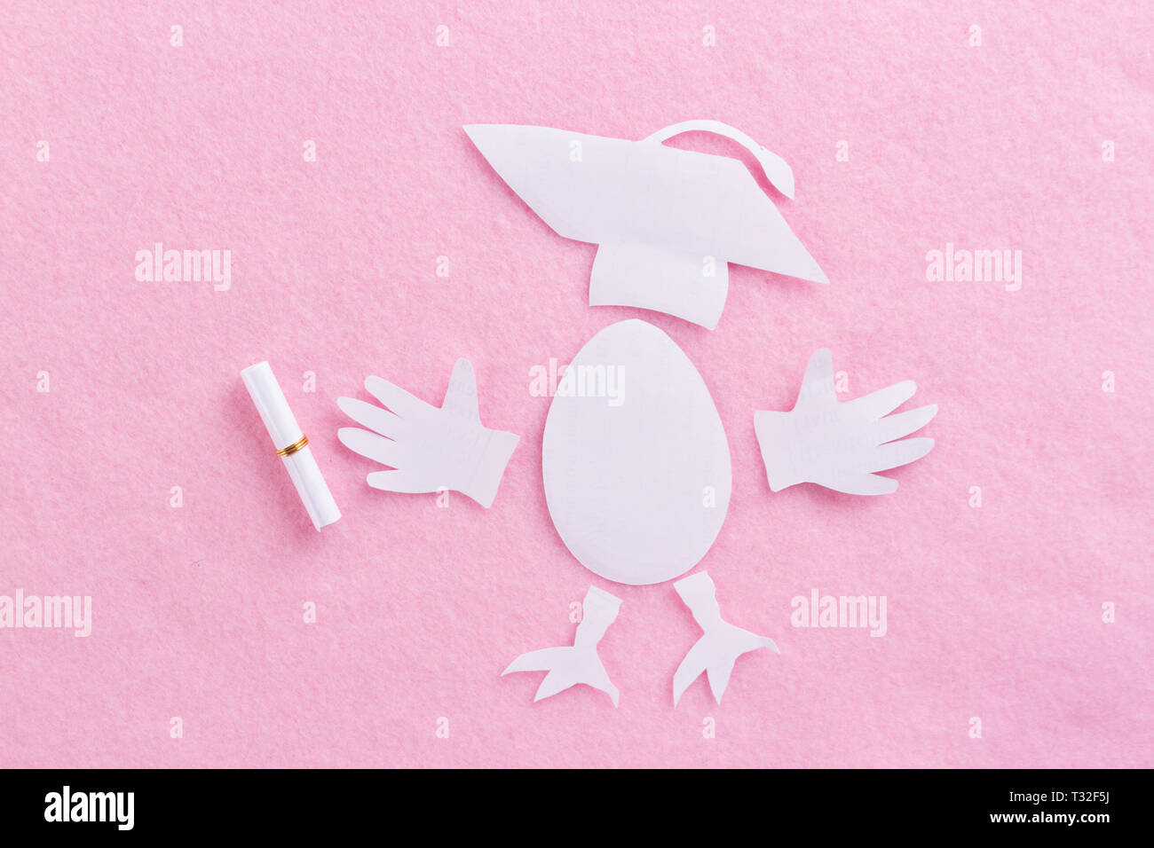 shot of graduation hats. paper egg character Stock Photo - Alamy