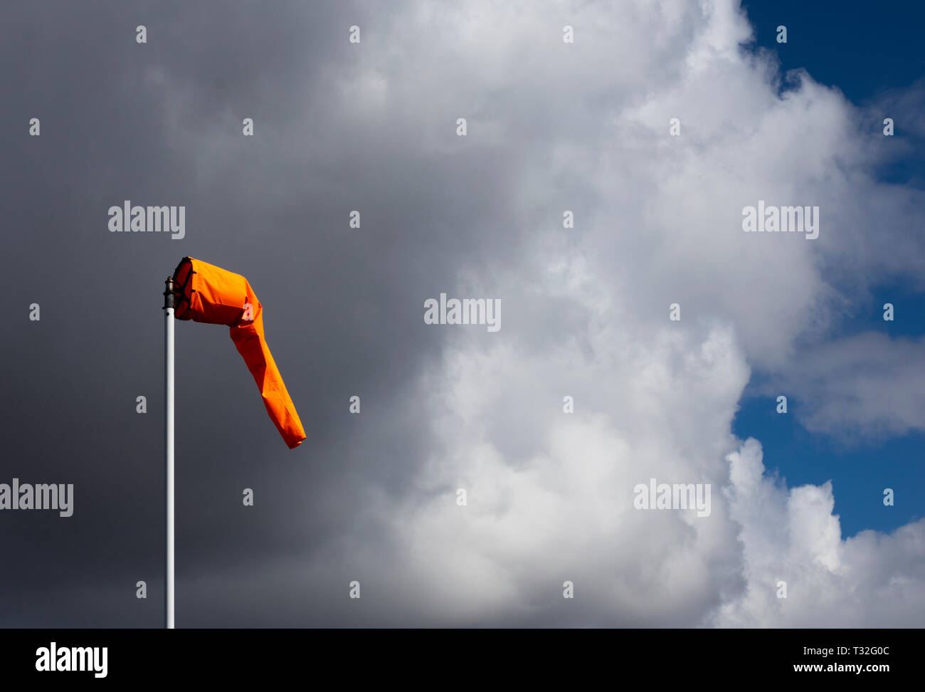 Airfield windsock, used to indicate wind speed and direction, shown ...