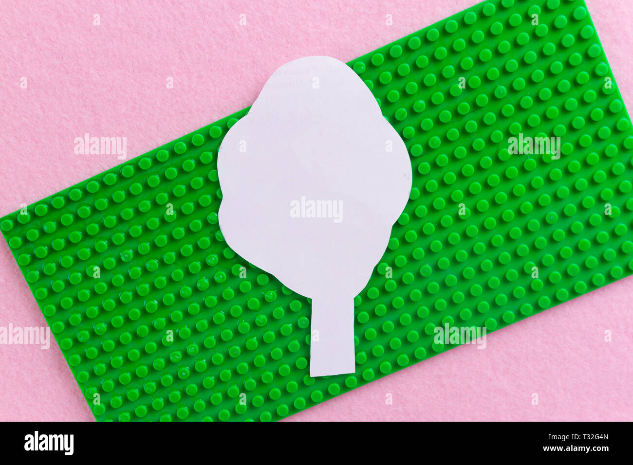paper tree on green background. eco concept Stock Photo - Alamy