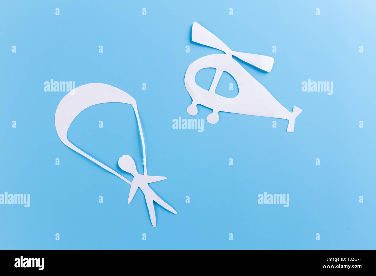 Skydiver freedom concept. paper person and parachute Stock Photo - Alamy