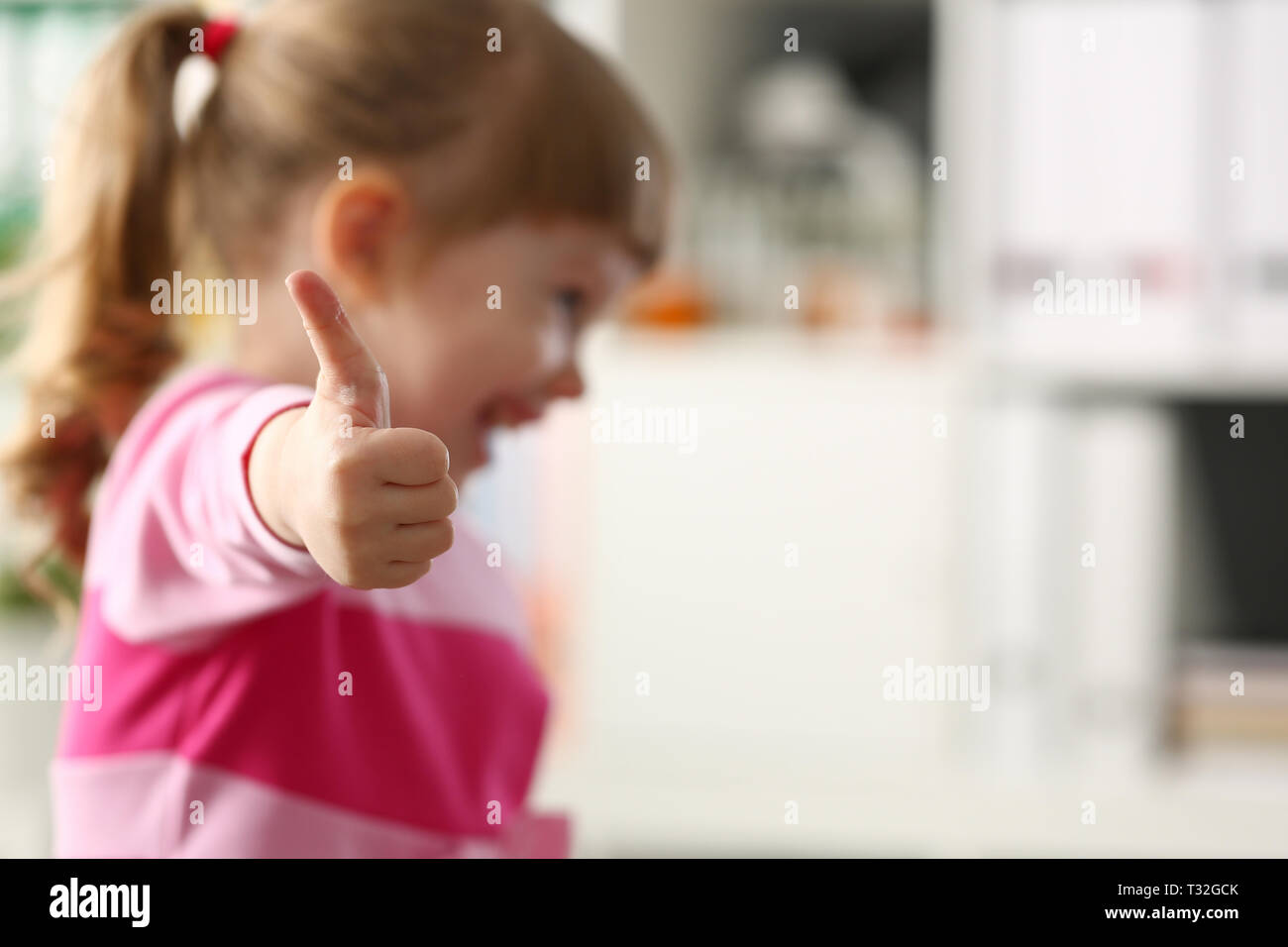 Little girl show approve or OK sign with her arm Stock Photo - Alamy