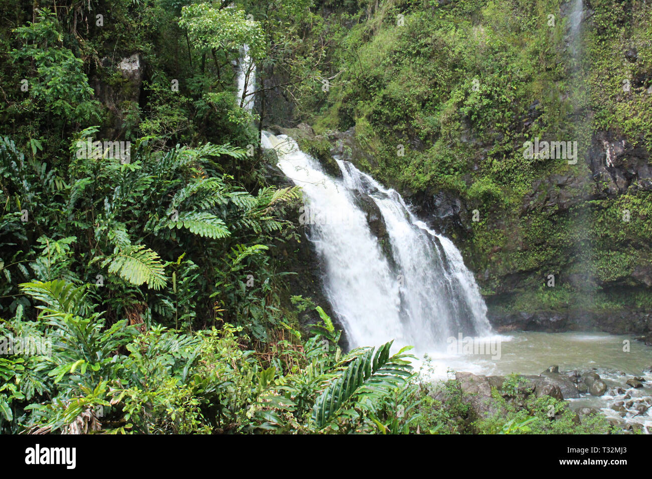 Three Bears Falls, also known as Upper Waikani Falls, cascading down a ...