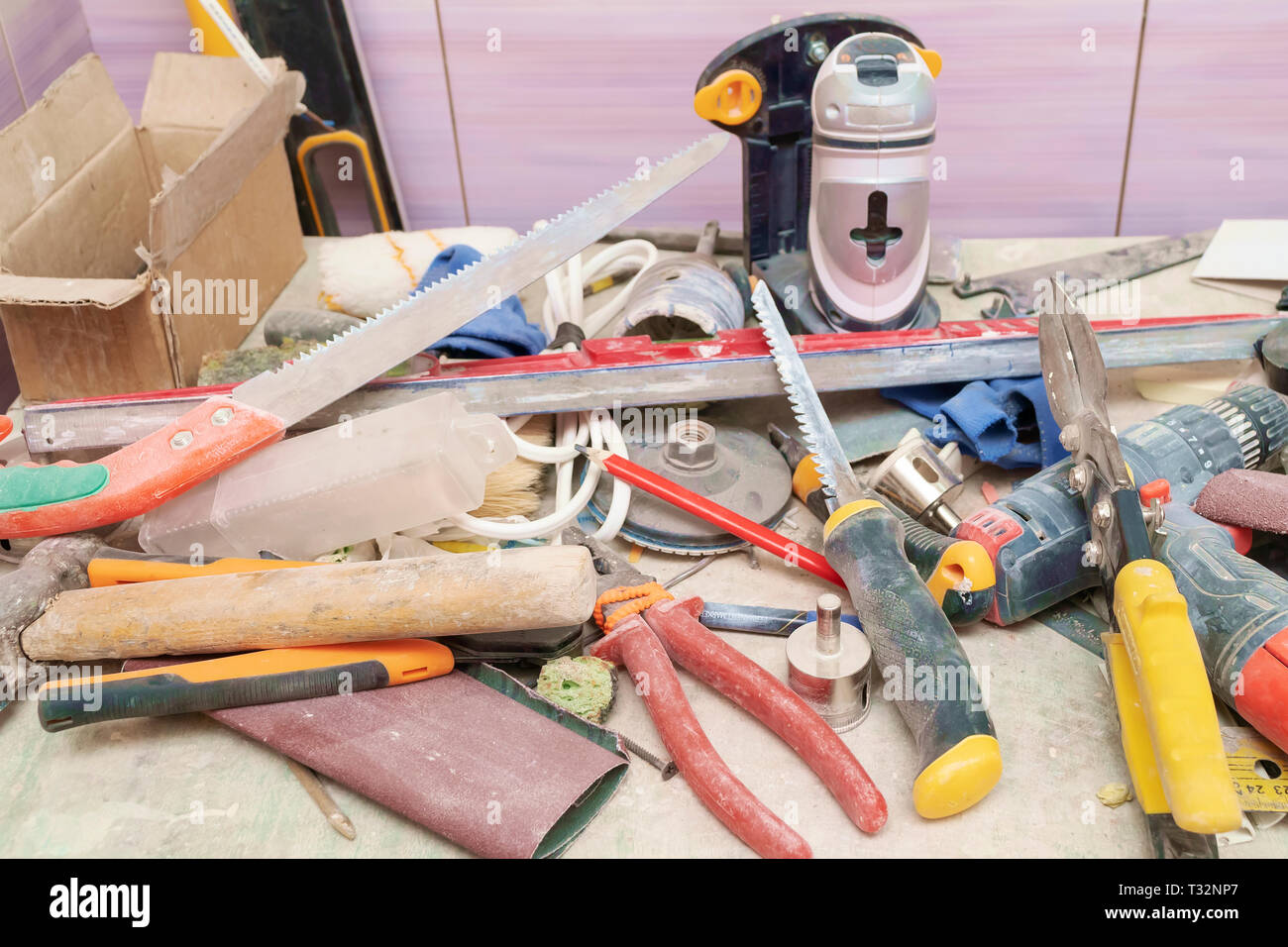 dirty construction tools randomly scattered on the desktop Stock Photo ...