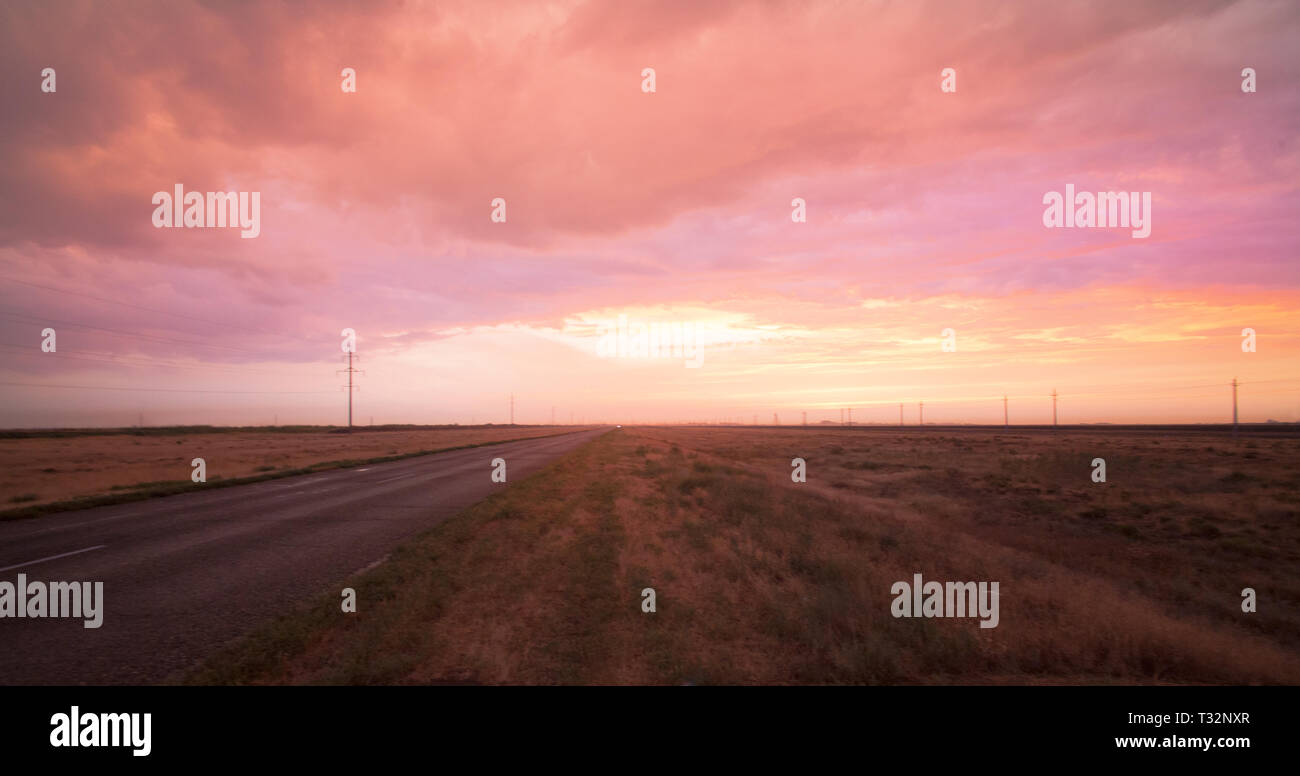 Cloudy sky over road hi-res stock photography and images - Alamy