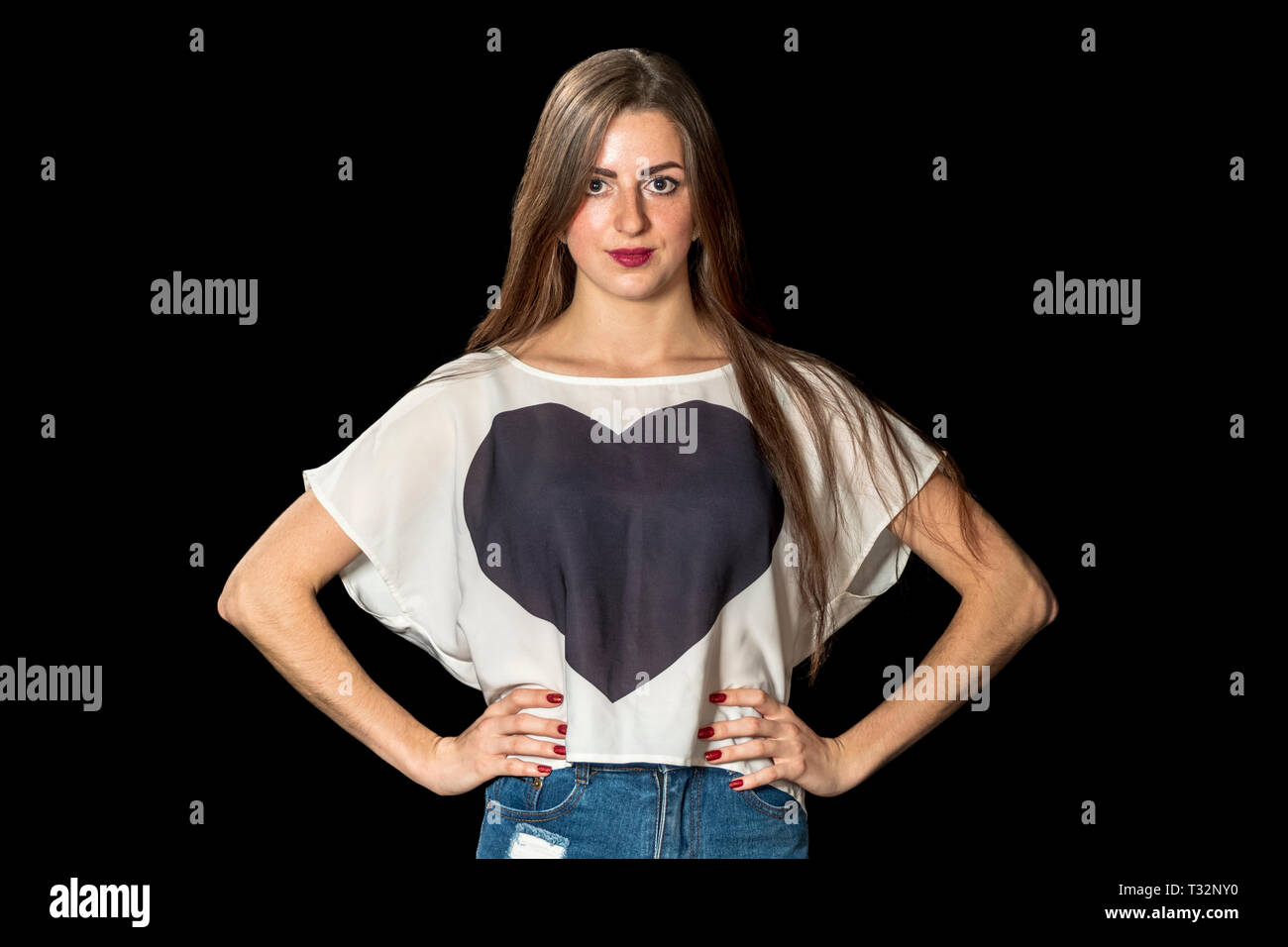 portrait of a beautiful woman with freckles and hands on hips, isolated ...