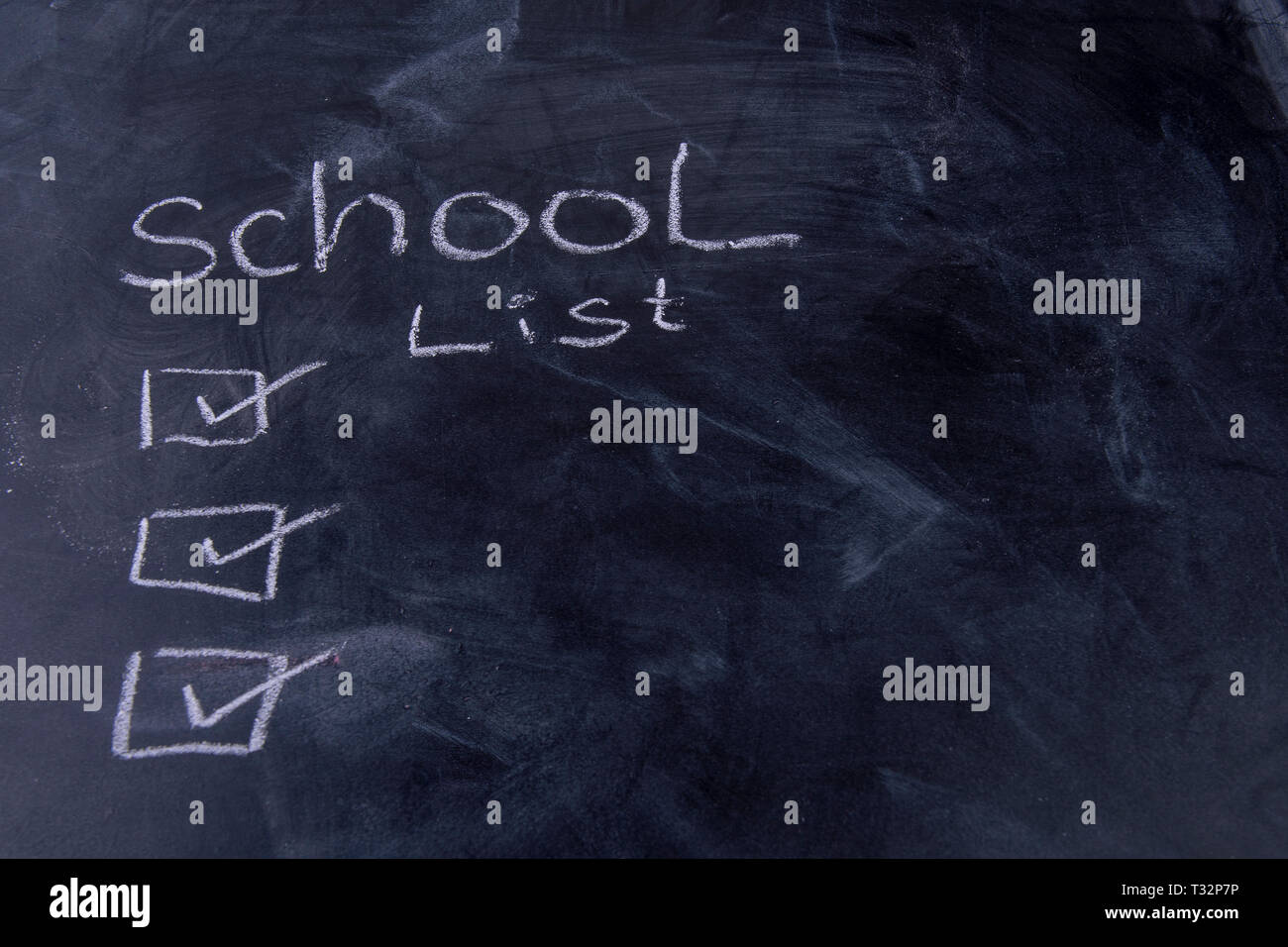 Board with a list of the word school and check boxes Stock Photo - Alamy