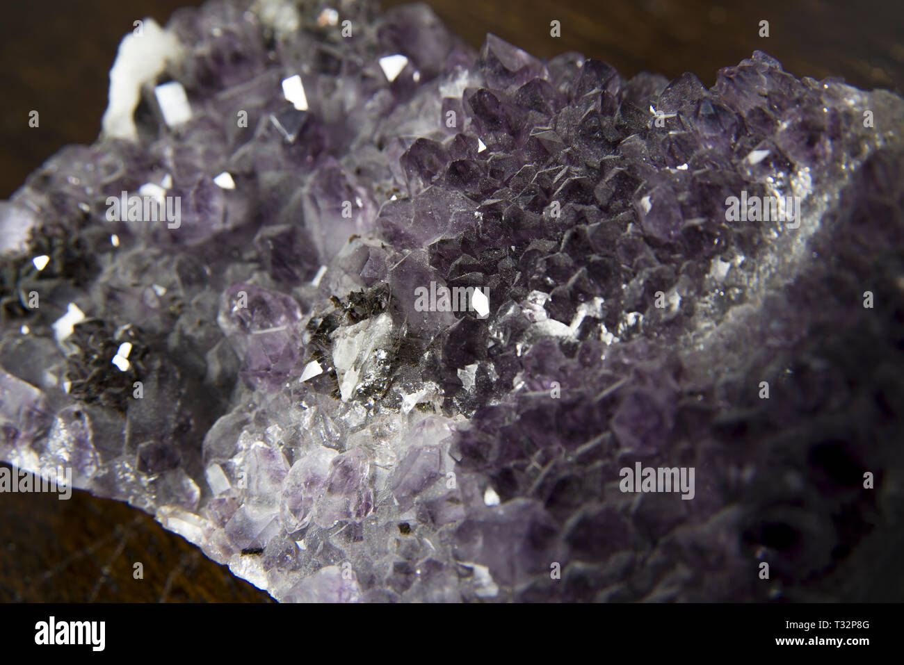 a purple amethyst in a close-up photo with highlights Stock Photo - Alamy