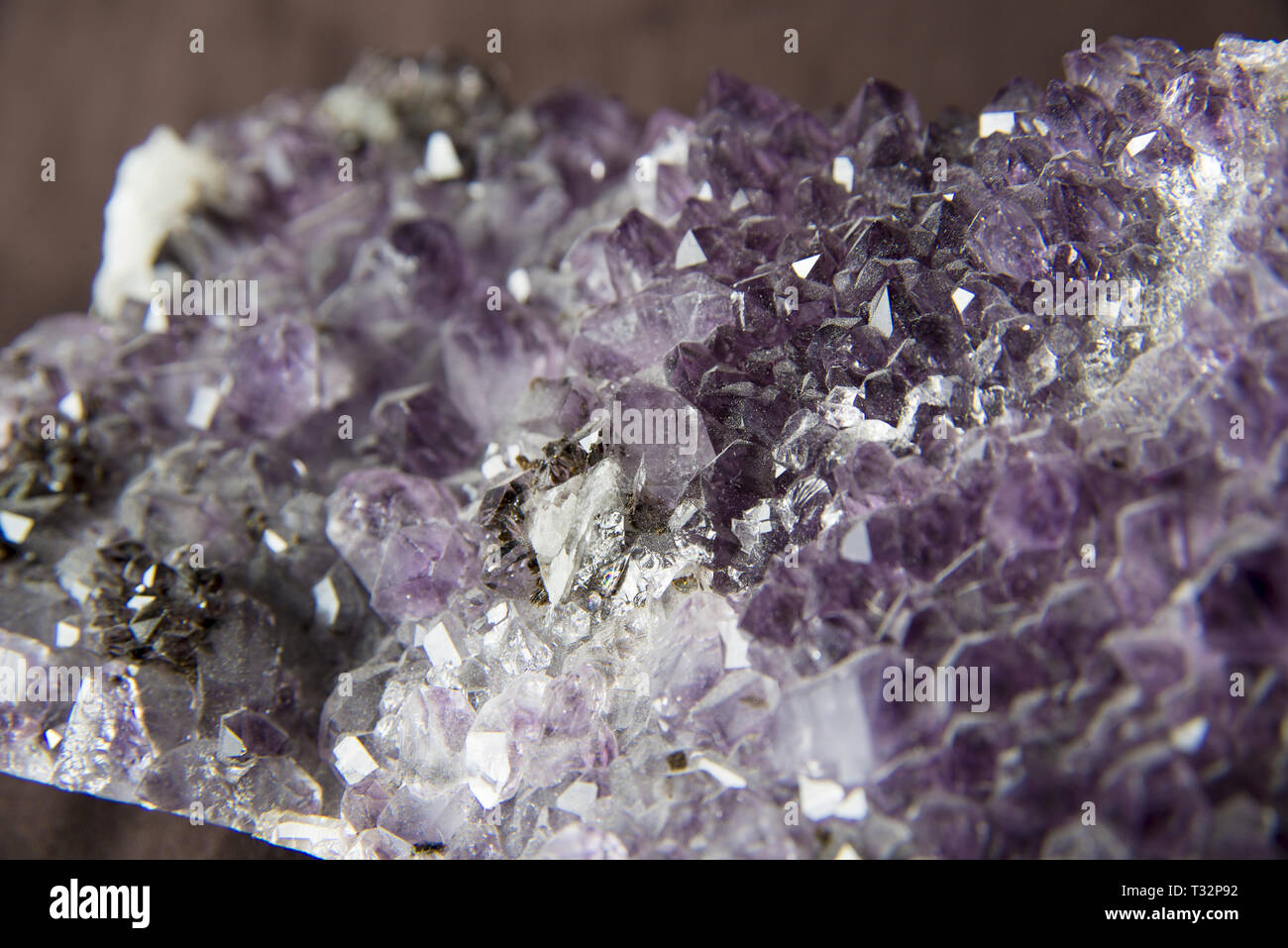 a purple amethyst in a close-up photo with highlights Stock Photo - Alamy