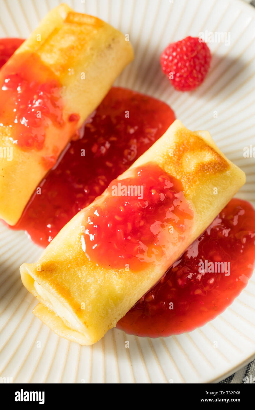 Sweet Homemade Cheese Blintzes with Raspberry Sauce Stock Photo - Alamy