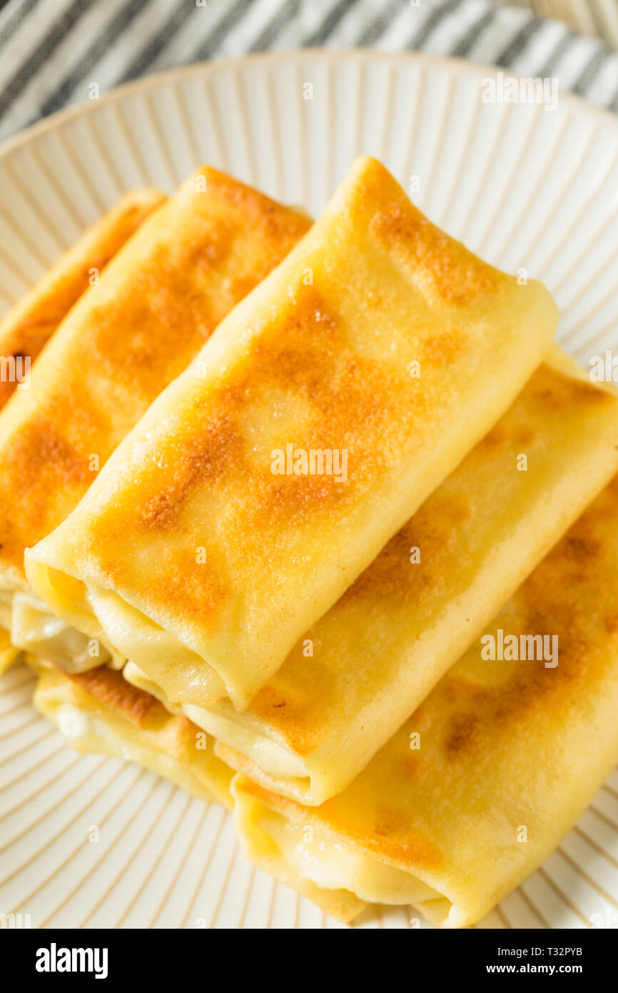 Sweet Homemade Cheese Blintzes with Raspberry Sauce Stock Photo - Alamy