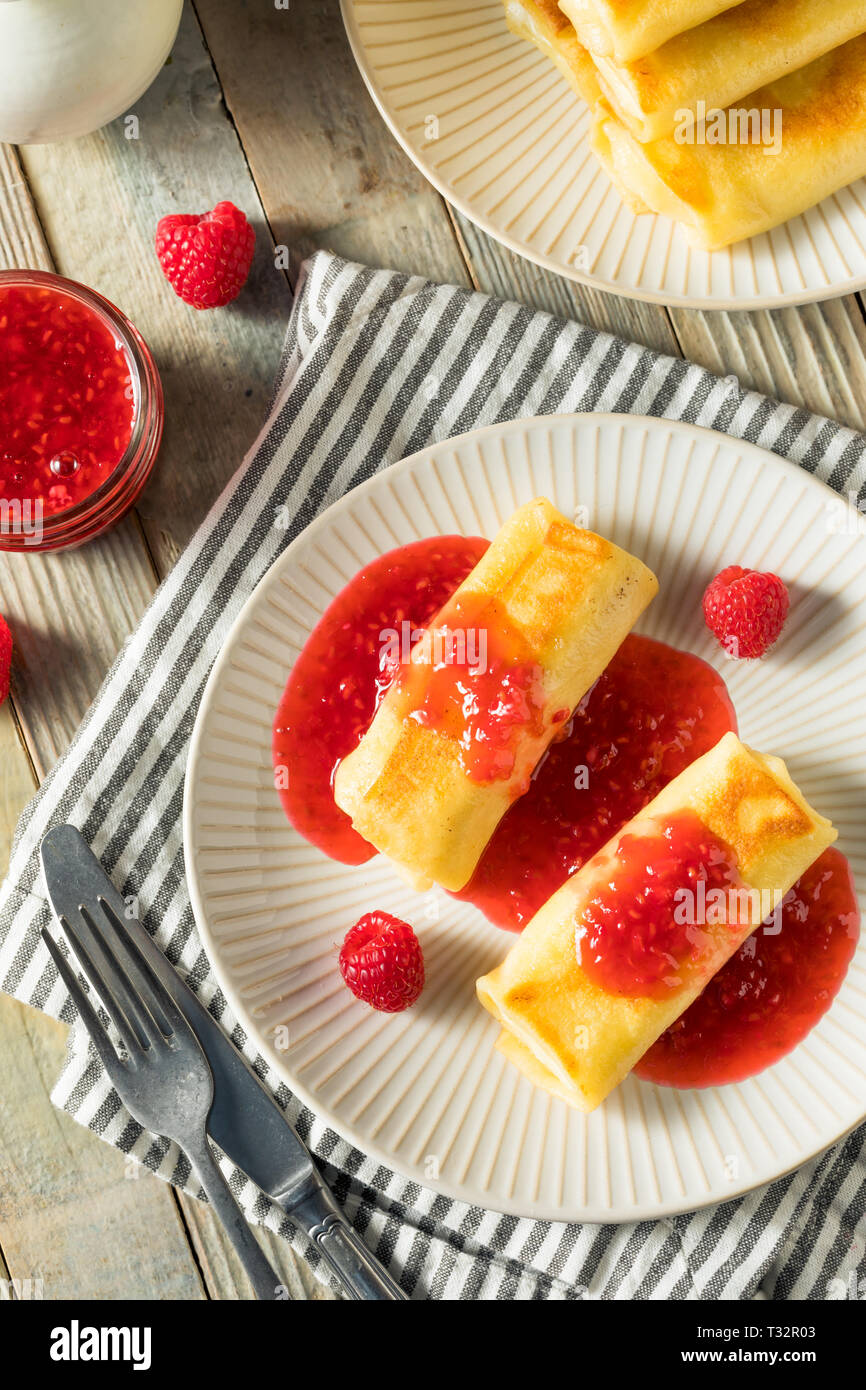 Sweet Homemade Cheese Blintzes with Raspberry Sauce Stock Photo - Alamy