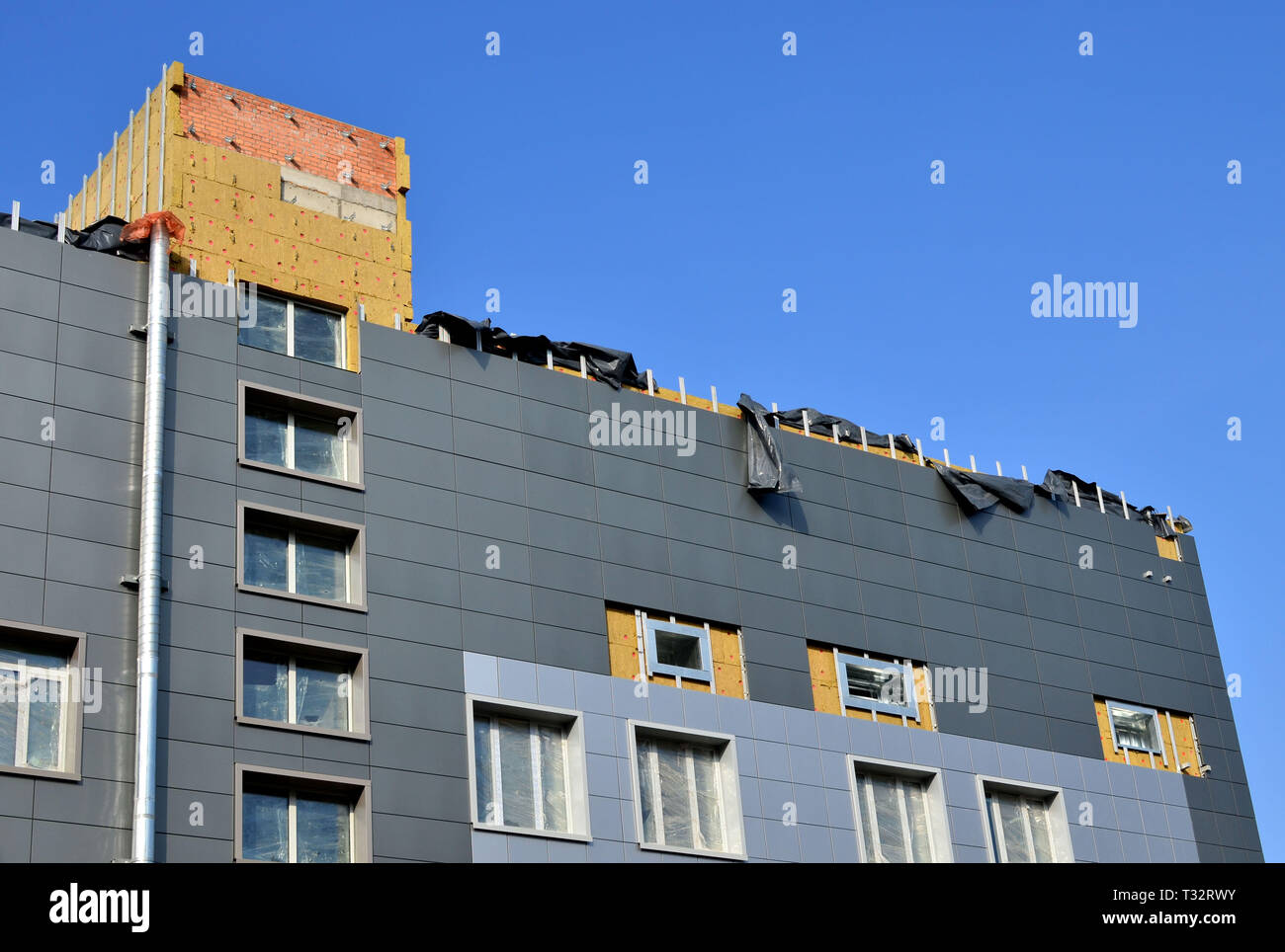 Facing of the building ventilated facade. Aluminum colored facades ...