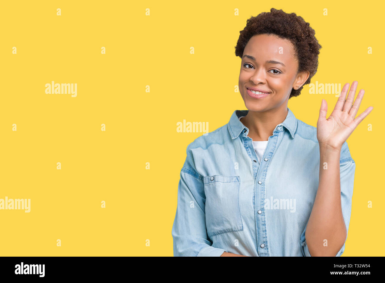 Young beautiful african american woman over isolated background Waiving ...