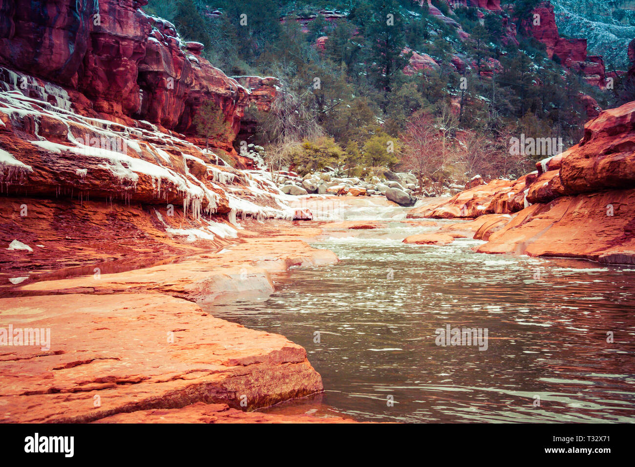 Water rushing through a creek in Sedona, AZ. The water is flowing over ...