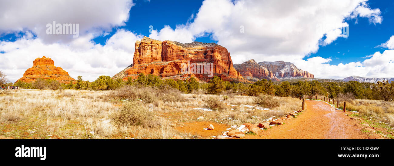 The red rock mountains of Arizona with a red dirt trail leading the ...