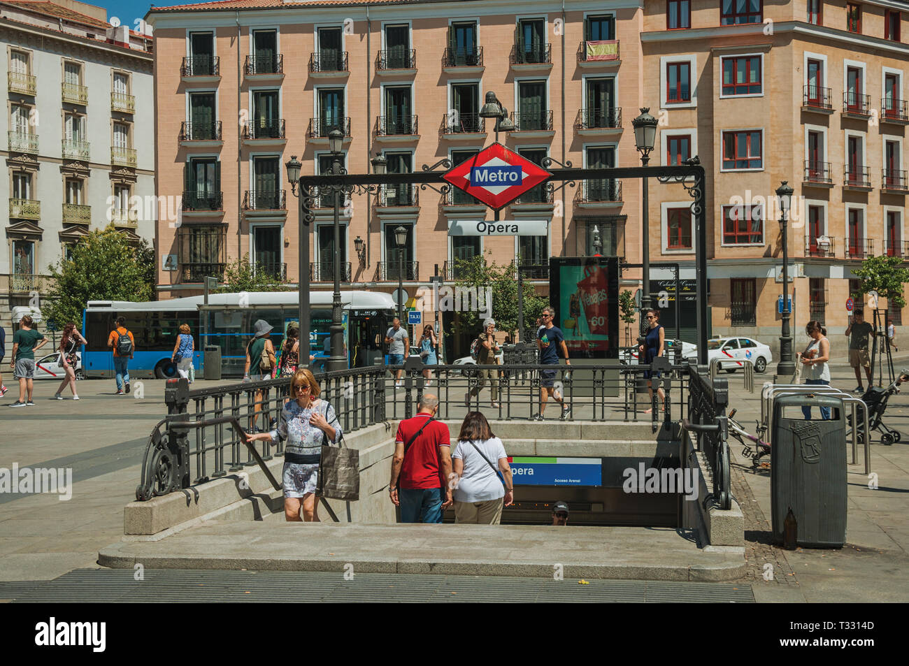 Opera metro station entrance on square with people and old buildings in ...