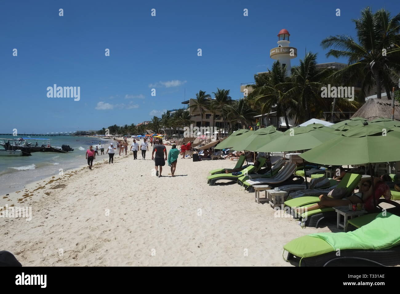 Sunbrellas Protecting Tourists From Harsh Sun Rays At Playa Del Carmen