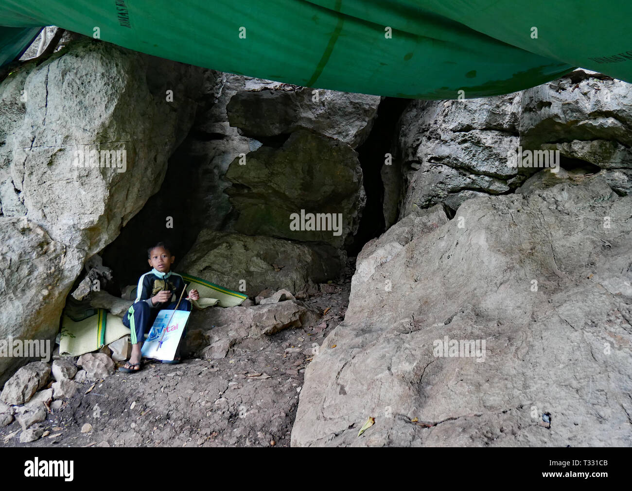 Battambang, Cambodia. The narrow fissure, to the right of the boy, my ...