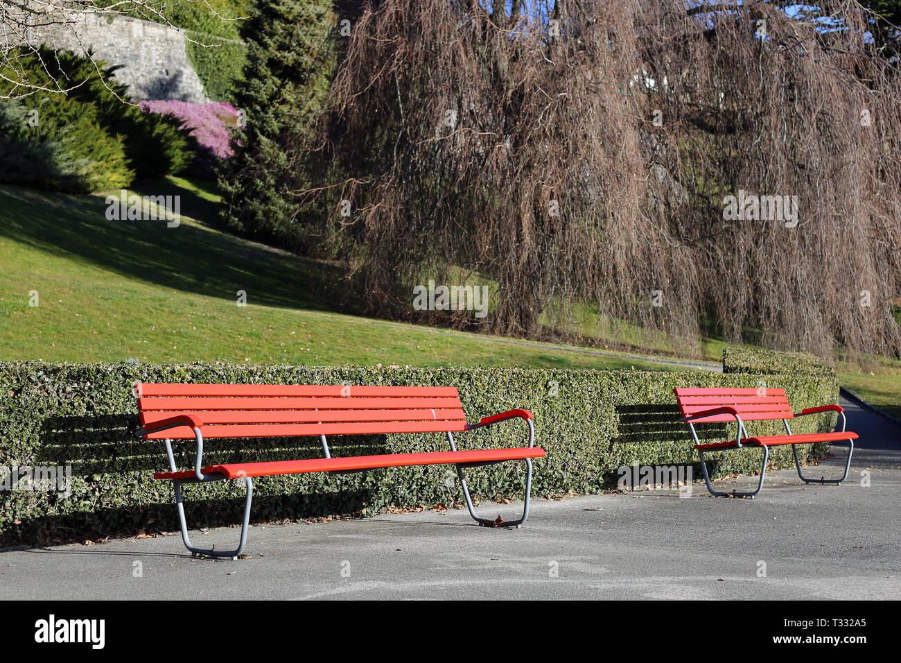 Sunny spring day in Nyon, Switzerland. In this photo you see two red ...