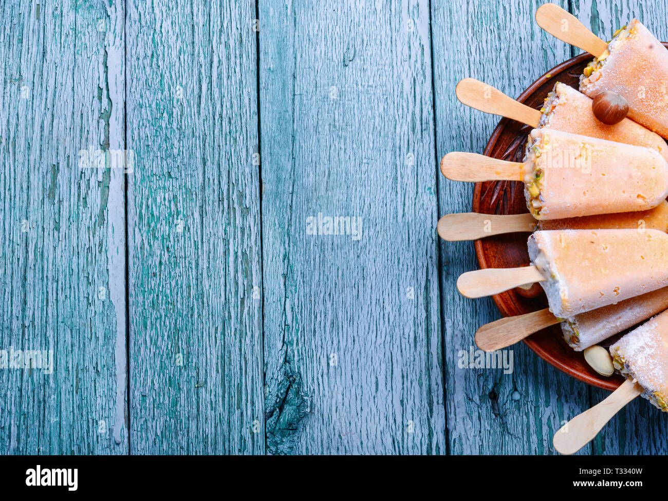 Group of homemade vanilla popsicles on a rustic wood background Stock ...