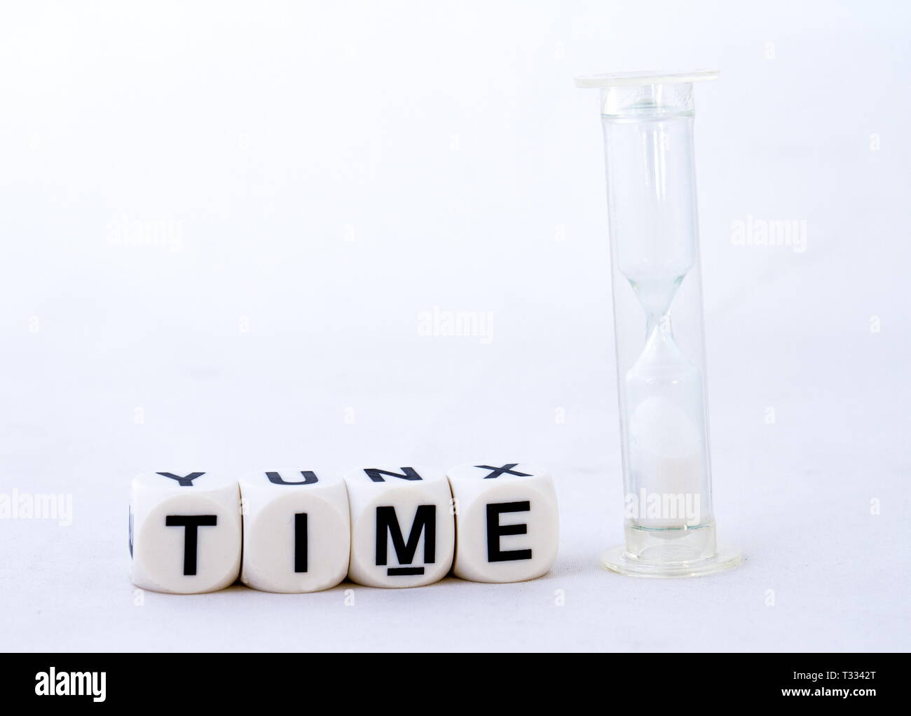 The term time in black text together with a hourglass isolated on a ...