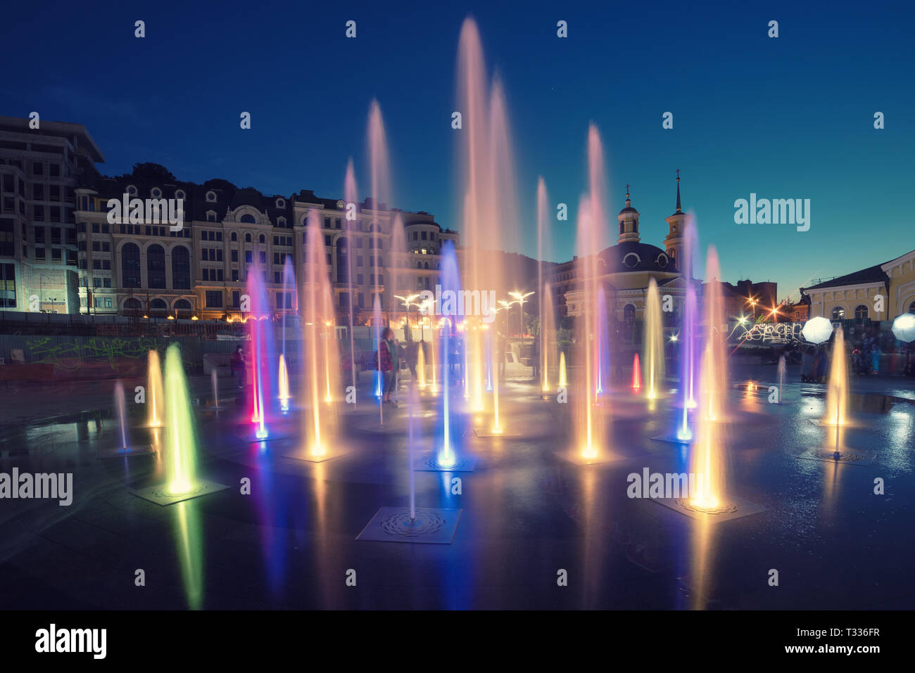 Musical fountain with colorful illumination at night with reflection ...