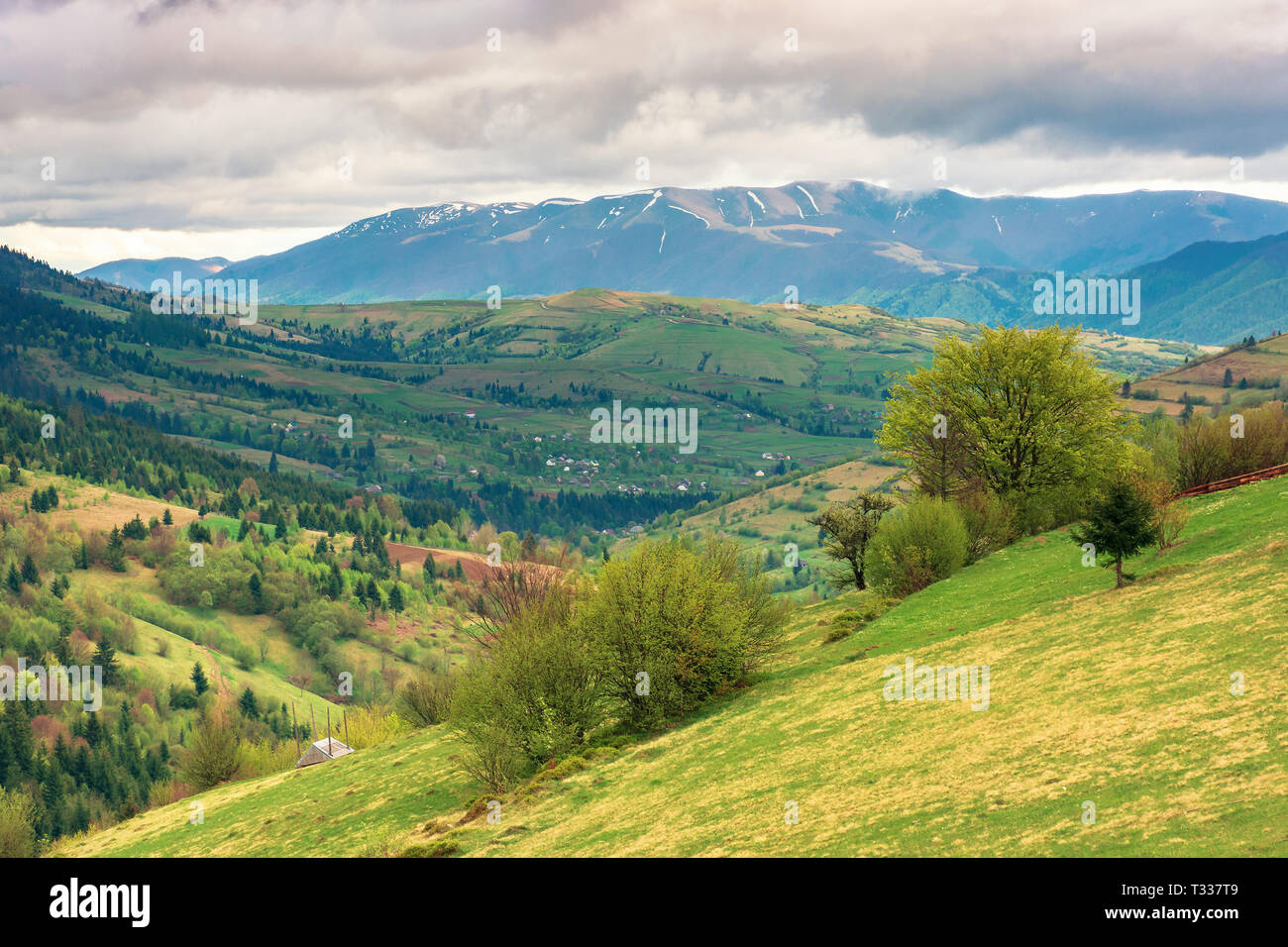 rural countryside in mountains. village in the distant mountain ...