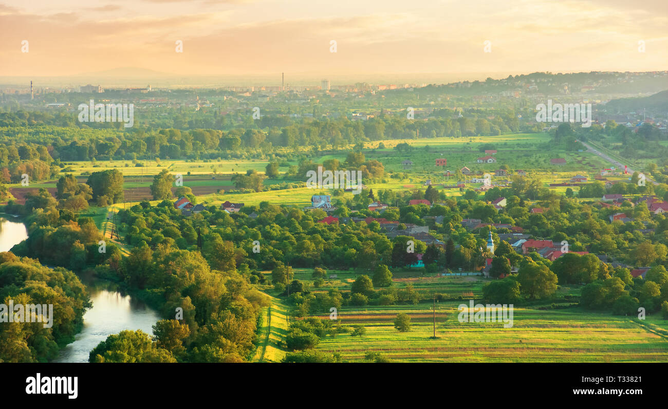 evening countryside scenery in springtime. village, agricultural fields ...