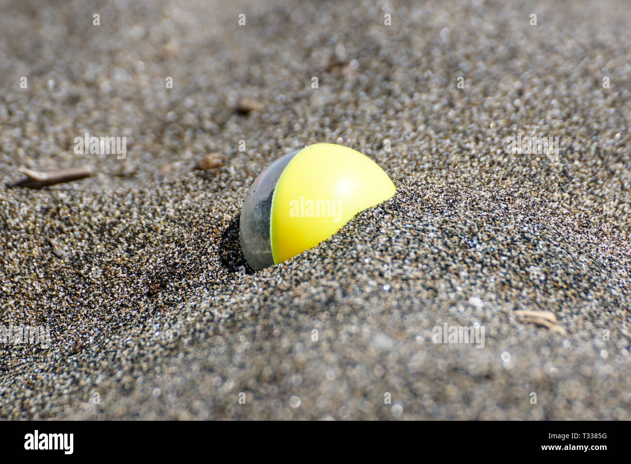 background with a beach ball in the sand Stock Photo - Alamy