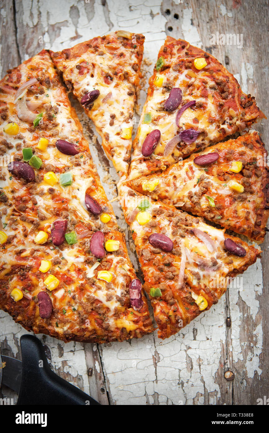 Mexican pizza with beef, corn, green pepper and red beans. Chilli con ...