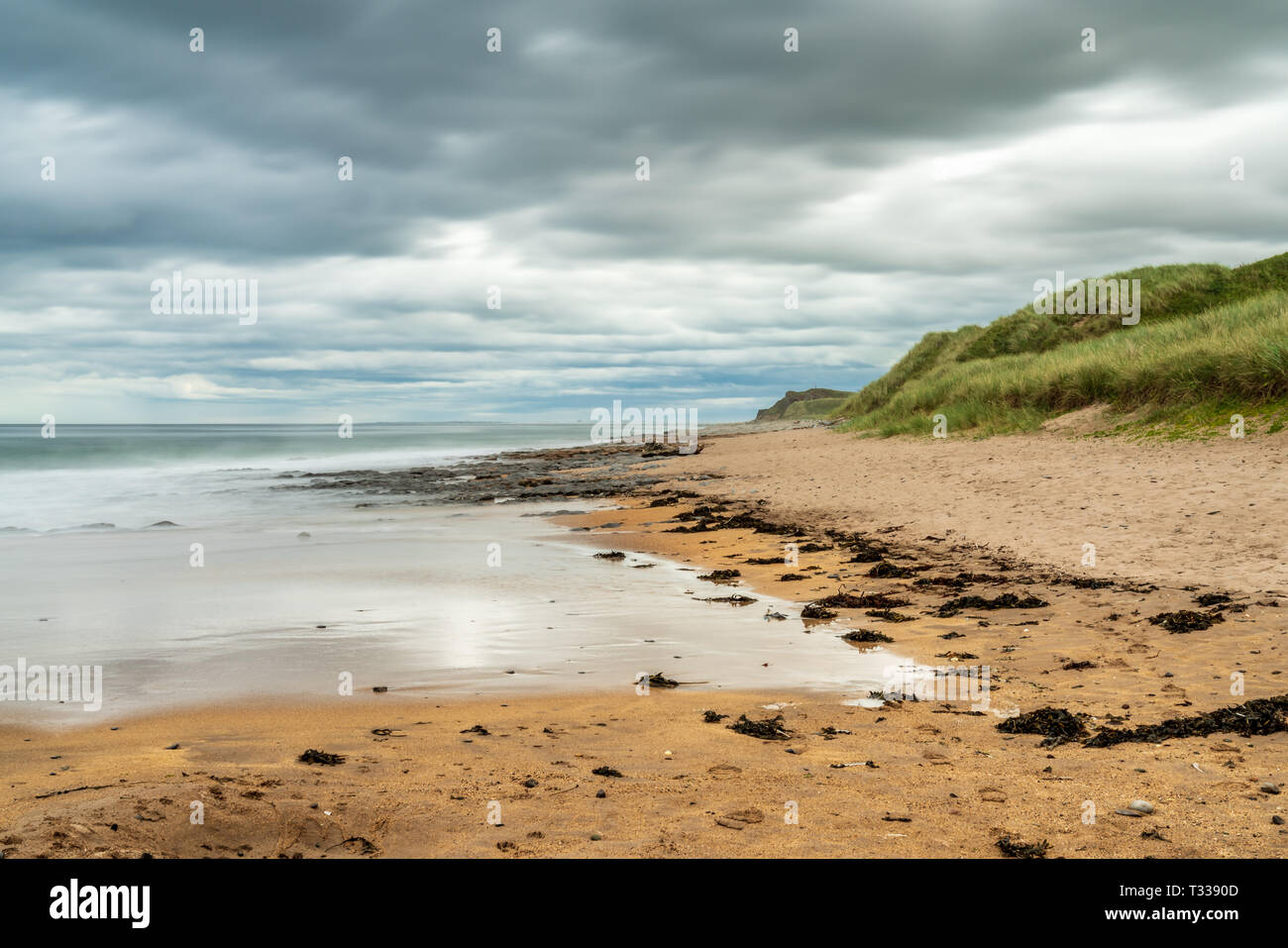 Dramatic sky over a beach, seen at Cocklawburn Beach near Berwick-upon ...