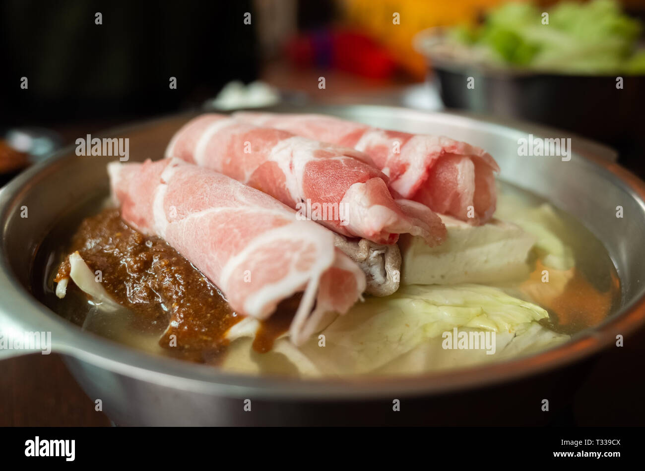 closeup image of hot pot with vegetables and pork Stock Photo - Alamy
