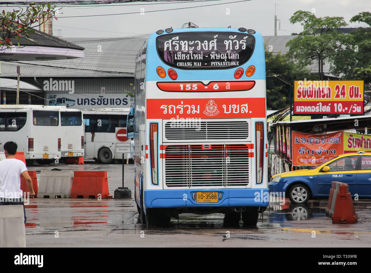CHIANG MAI, THAILAND - SEPTEMBER 8 2011: Srithawong tour company bus ...