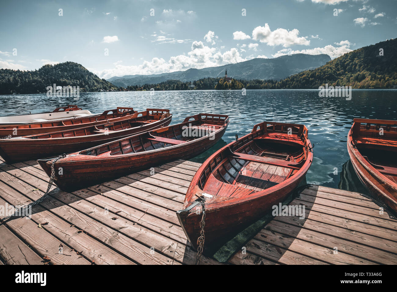 Traditional Pletna boat on the lake. In the background is the famous ...