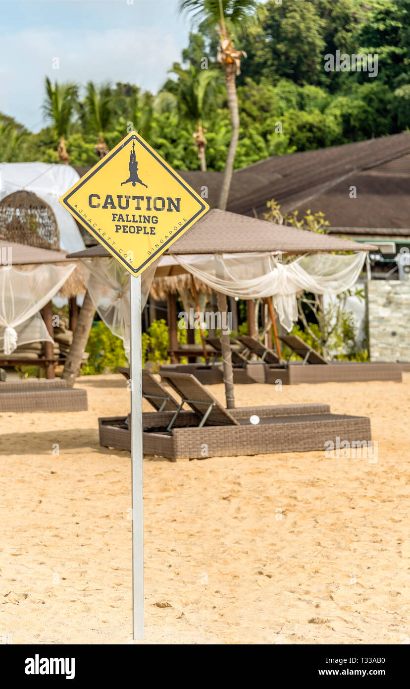 "Falling People" warning signboard at Siloso Beach on Sentosa Island ...