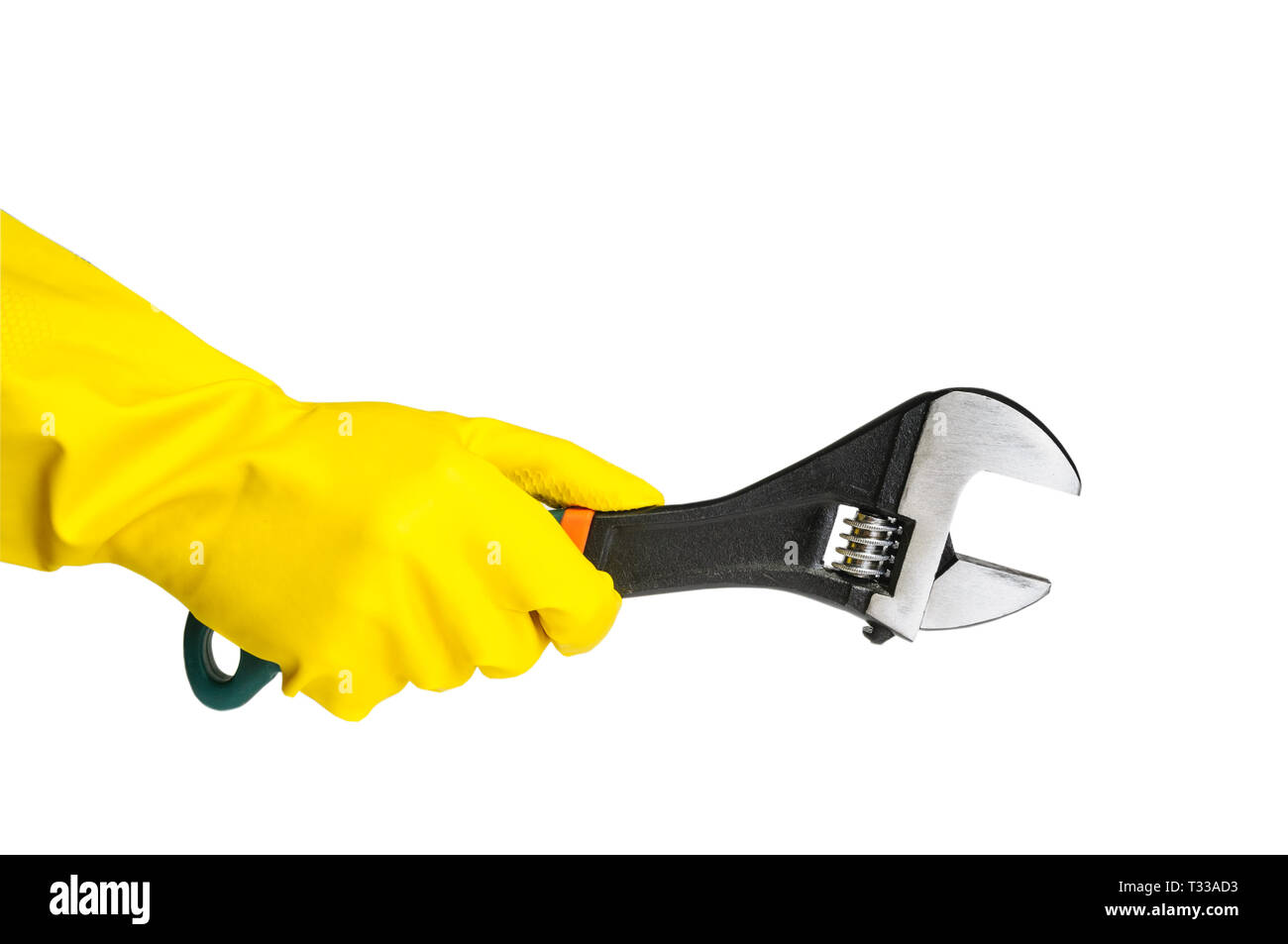 Hand in work glove holding adjustable wrench. Clipping path included ...