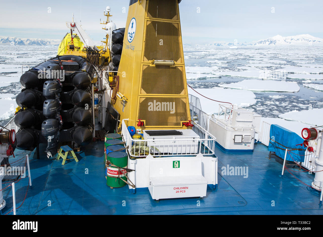 An ice strengthened Antarctic cruise ship pushing through sea ice near ...