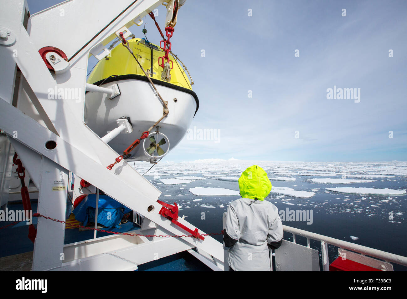An ice strengthened Antarctic cruise ship pushing through sea ice near ...