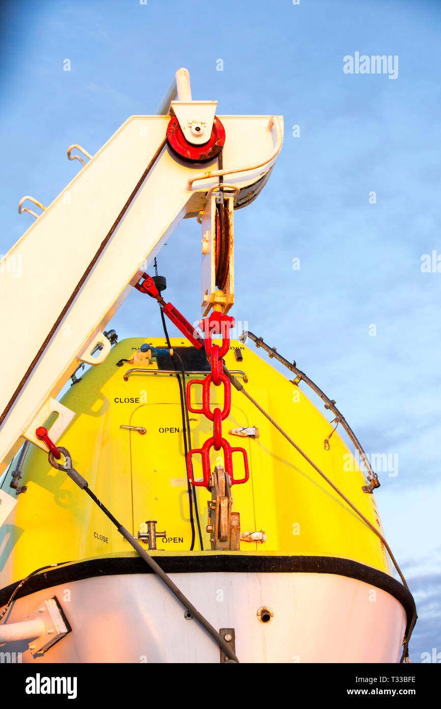 Lifeboat on an Antarctic cruise ship glowing in the late evening sun ...