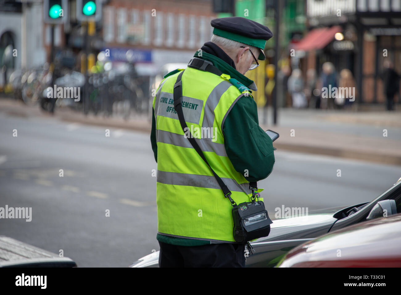 civil enforcement officer or traffic warden with glasses in typical ...